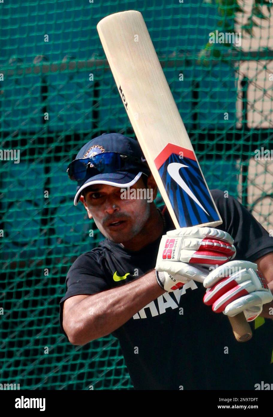 Indian cricketer Subramaniam Badrinath bats during a practice session ...