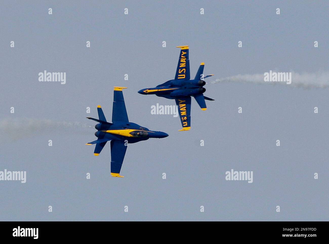 The U.S. Navy Blue Angels execute a precision crossing maneuver during ...