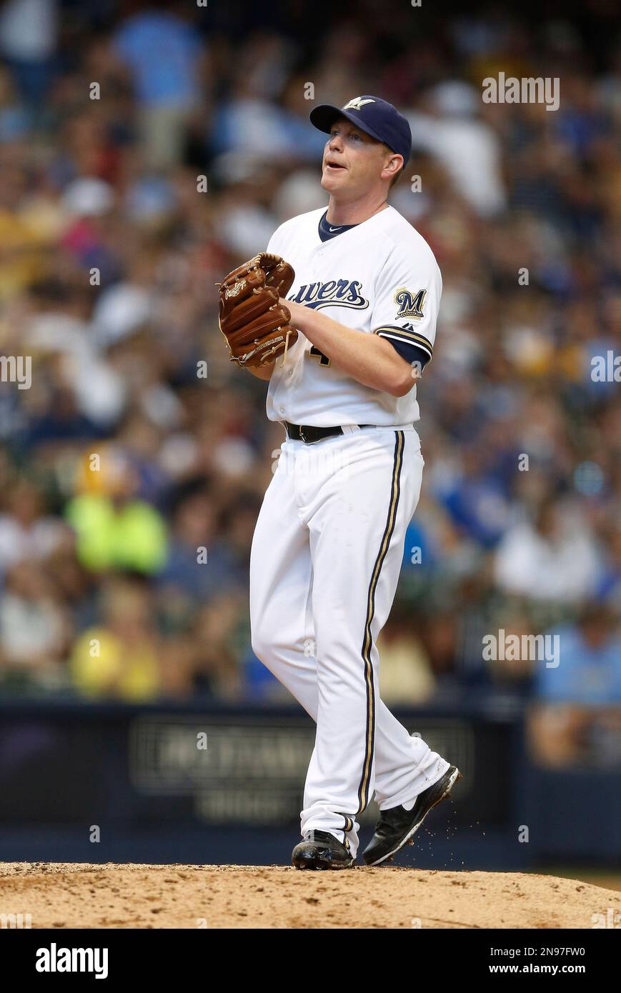 Milwaukee Brewers' pitcher Randy Wolf stands on the mound after giving ...