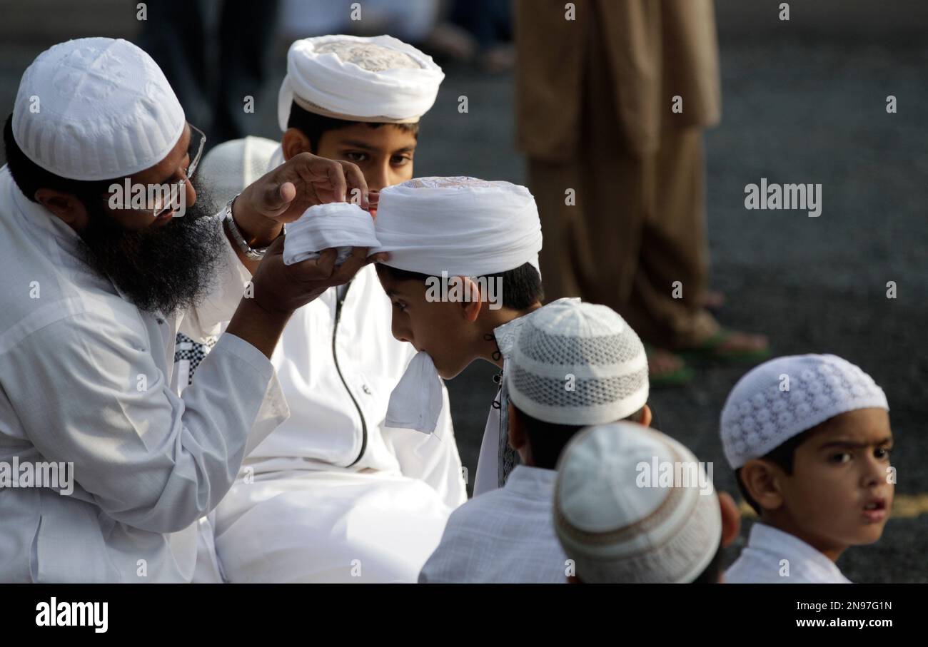 Muslims attend Eid al-Fitr prayer, which marks the end of the holy ...