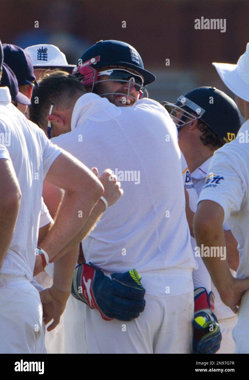 England's Matt Prior, helmet facing, hugs Graeme Swann after they ...