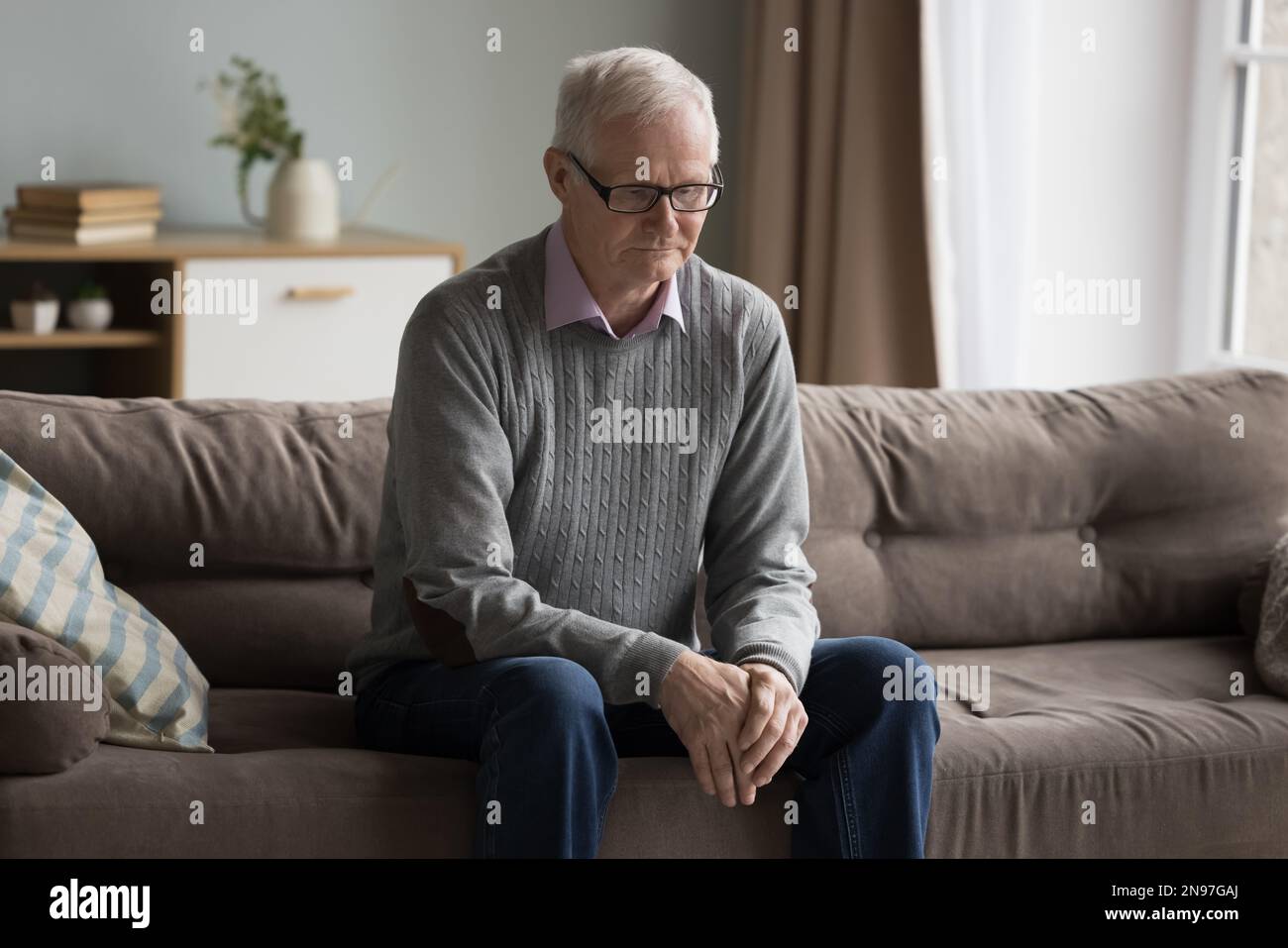 Sad depressed elderly man feeling lost, lonely at home Stock Photo - Alamy