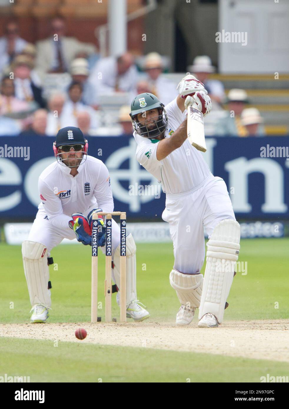 South Africa's Hashim Amla hits a ball from England's Graeme Swann ...