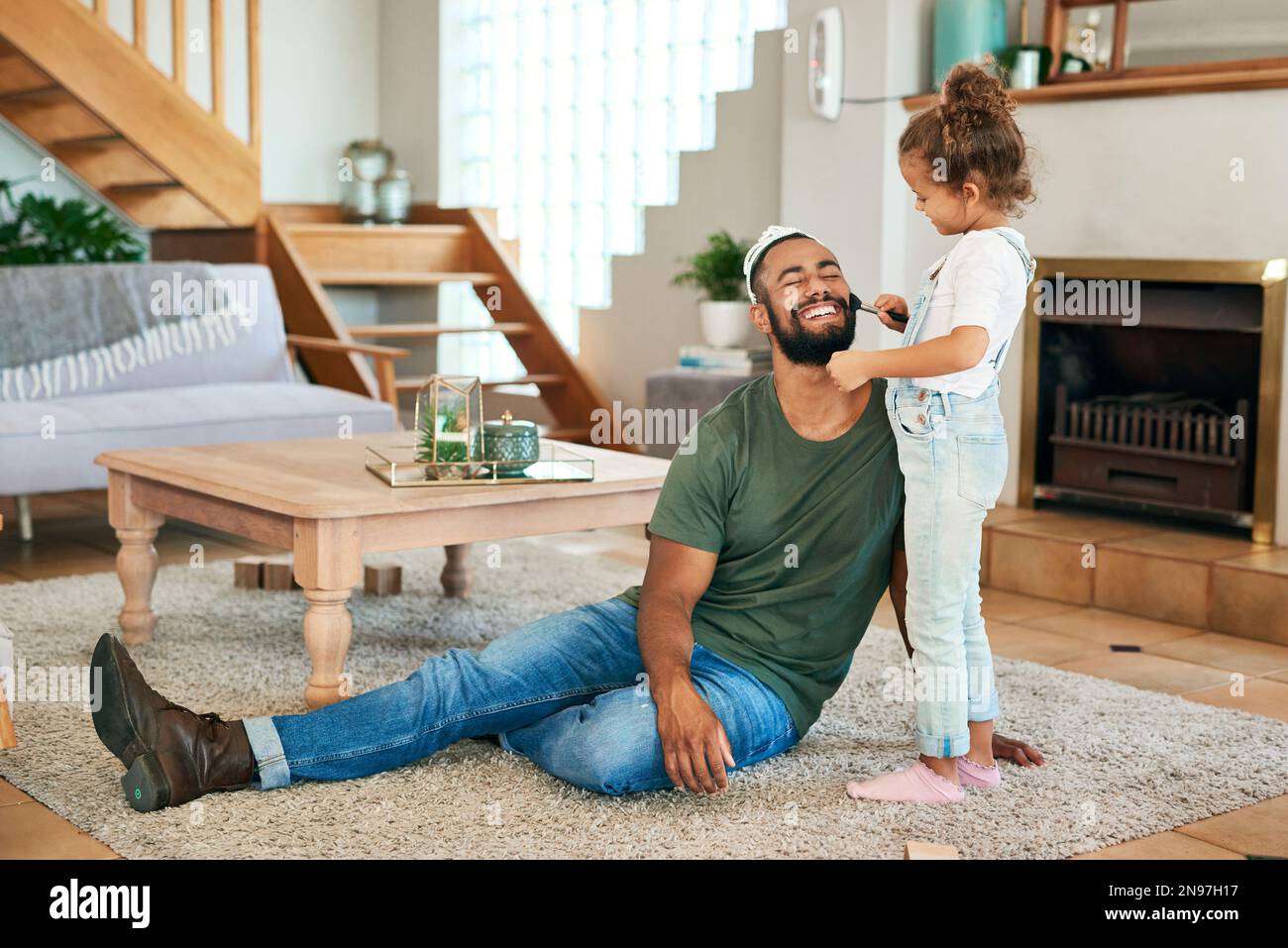 Youre going to look so pretty when Im done, Daddy. a little girl putting makeup on her father ...