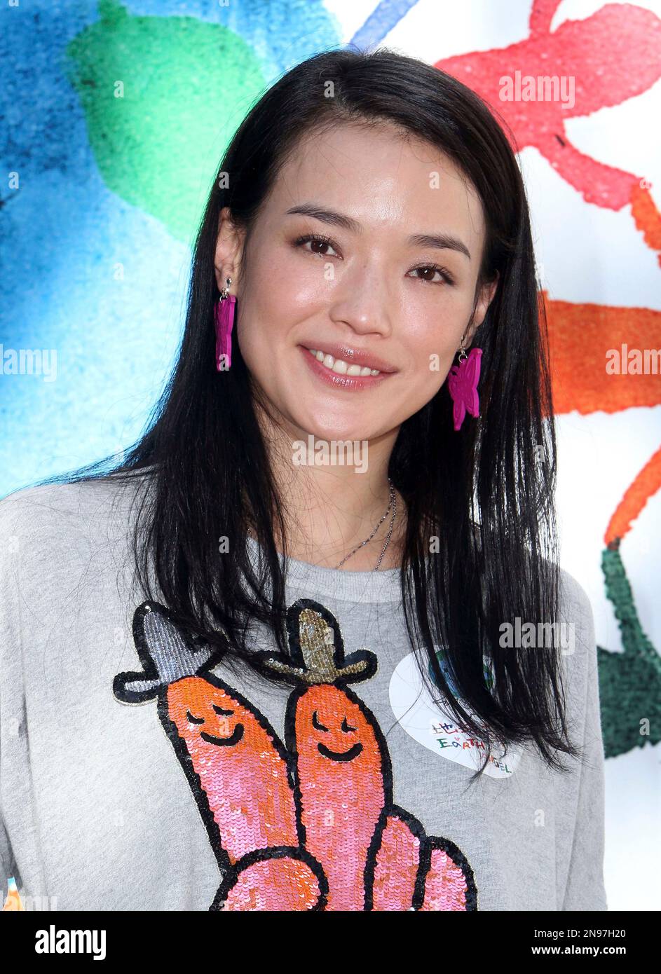 Taiwanese actress Shu Qi smiles during a public welfare event in Taipei ...