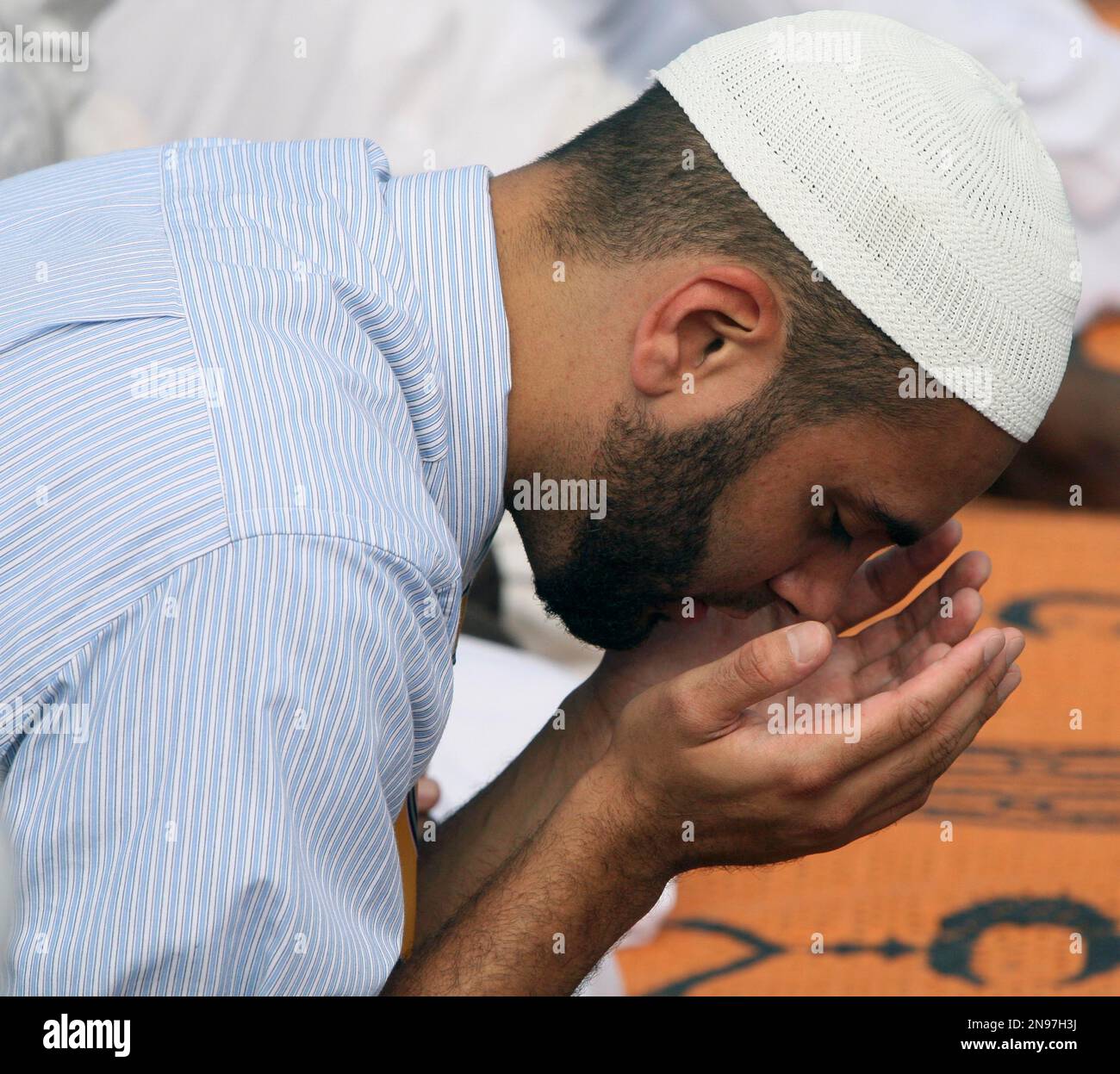 A Kenyan Muslim prays during Eid al-Fitr prayers at the end of the holy ...