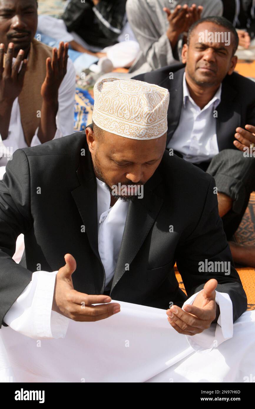 A Kenyan Muslim performs during Eid al-Fitr prayers at the end of the ...