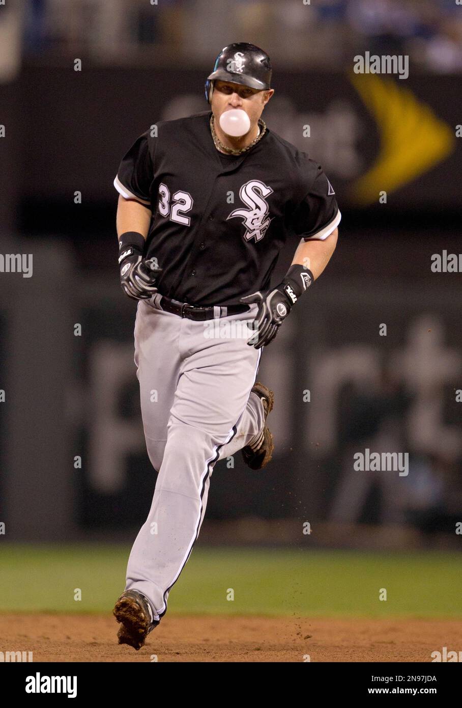 Chicago White Sox's Adam Dunn (32) rounds the bases after hitting a two ...