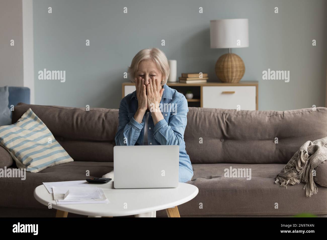 Shocked concerned senior accountant woman finding financial failure ...