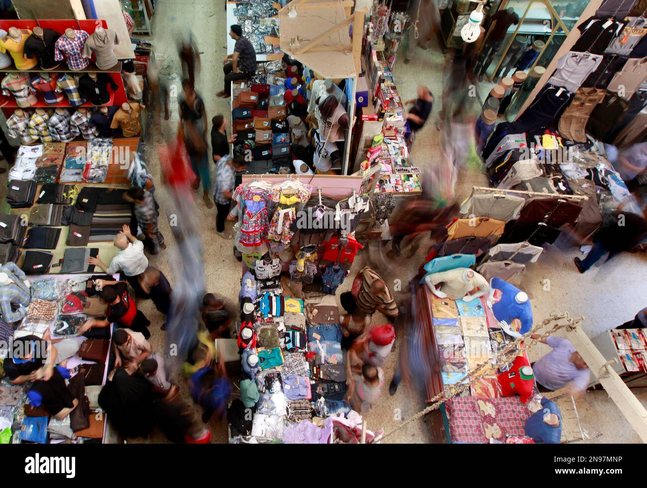 Iraqis buy clothes for Eid al-Fitr at the Shorjah market in central ...