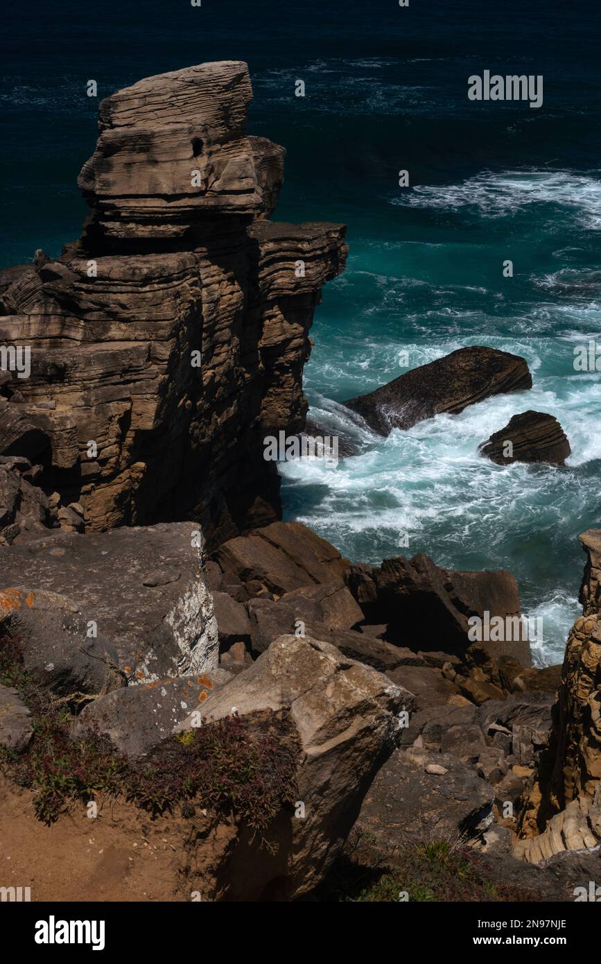 Sea pillars and stacks of stratified rock, sculpted into curious shapes ...