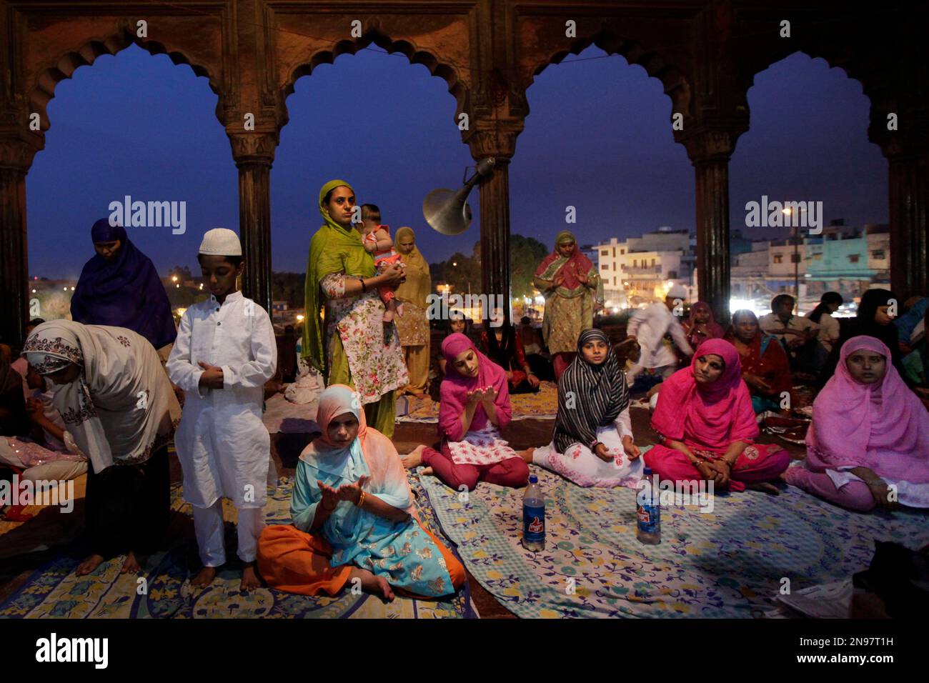 Indian Muslims pray after breaking their Ramdan fast on the last Friday ...