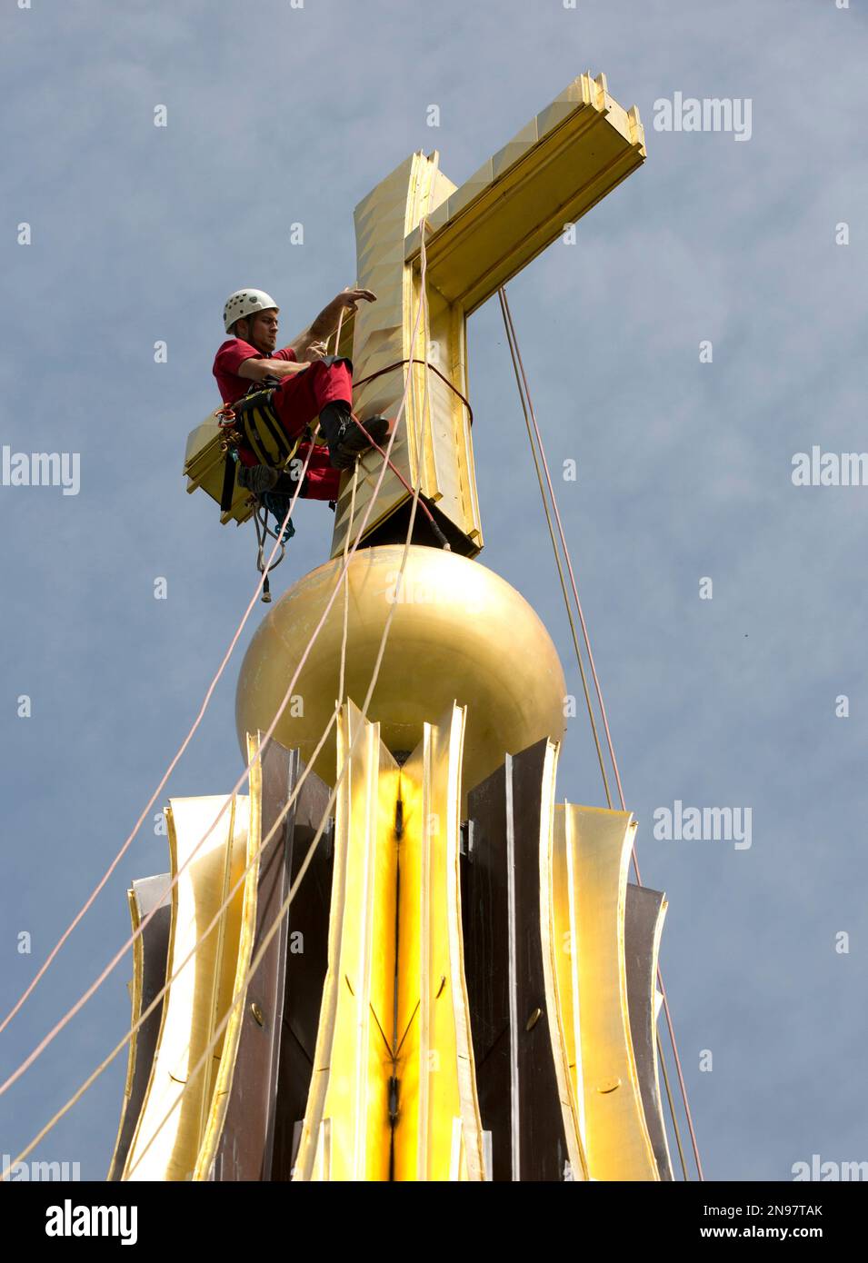 The golden cross atop Berlin Cathedral is inspected by an industrial ...
