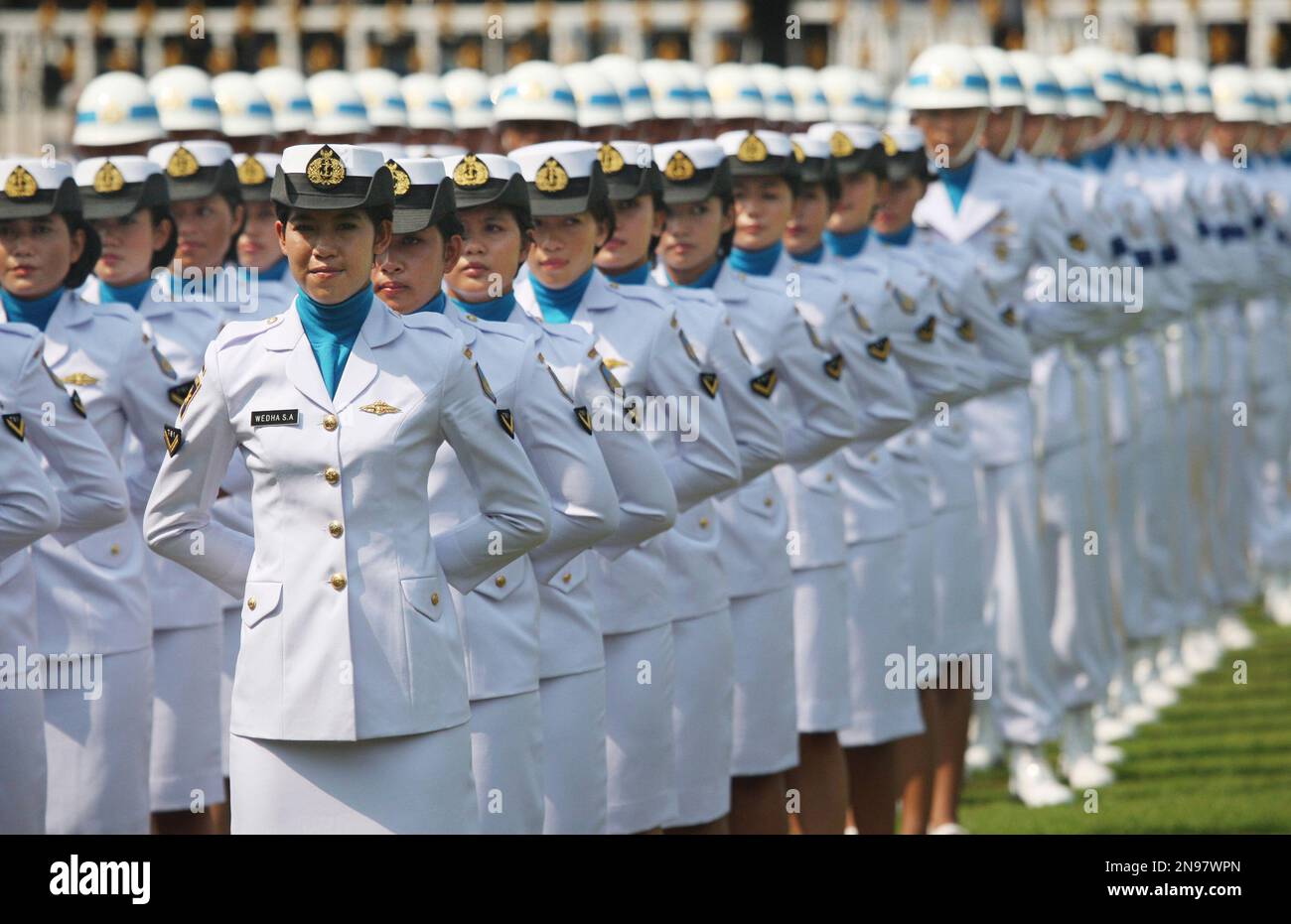 Members of Indonesian Navy stand in line during a flag hoisting ...