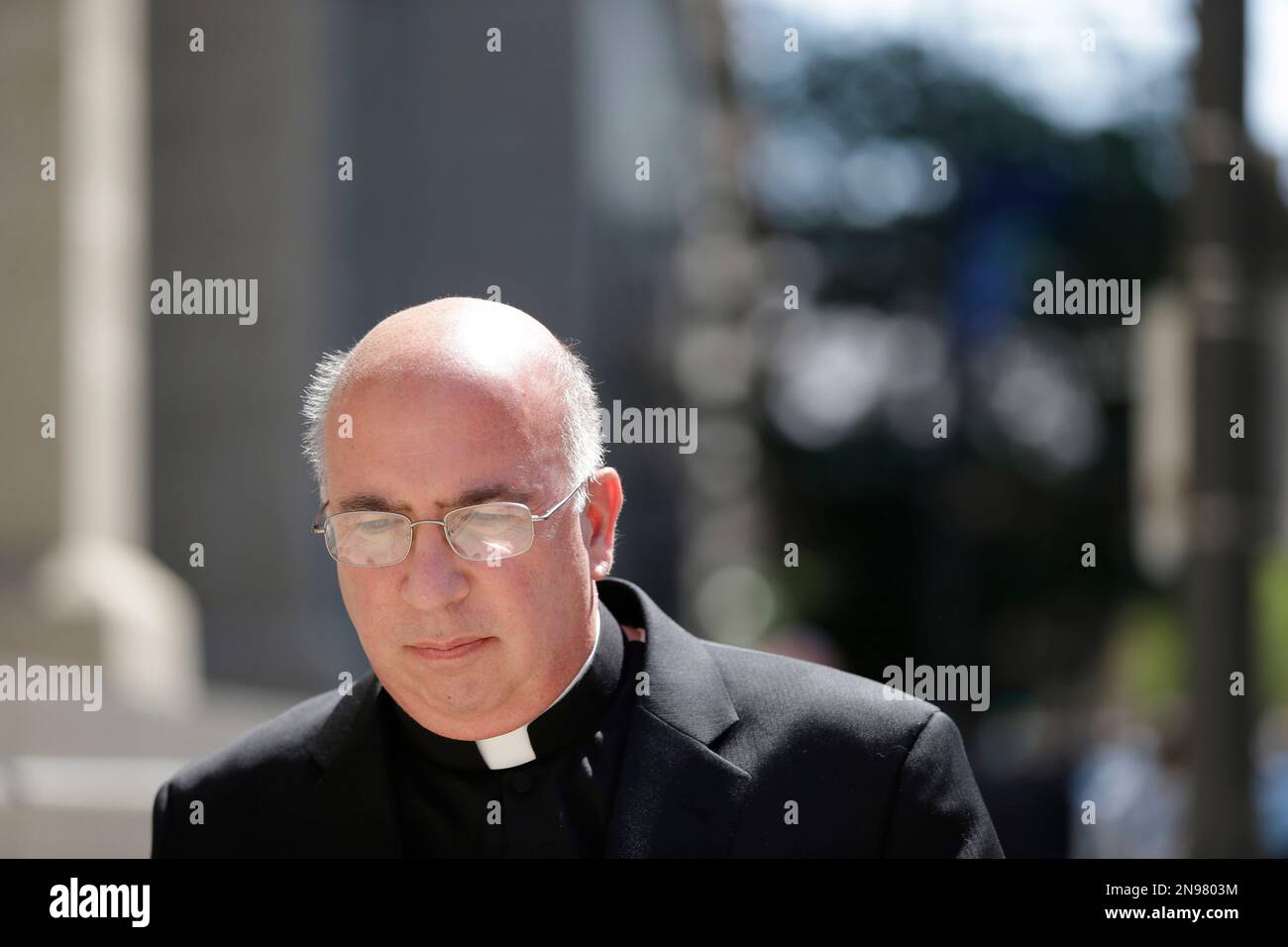 The Rev. Andrew McCormick walks from the Criminal Justice Center after ...