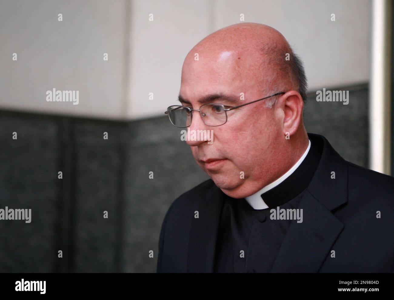 The Rev. Andrew McCormick walks from the Criminal Justice Center after ...
