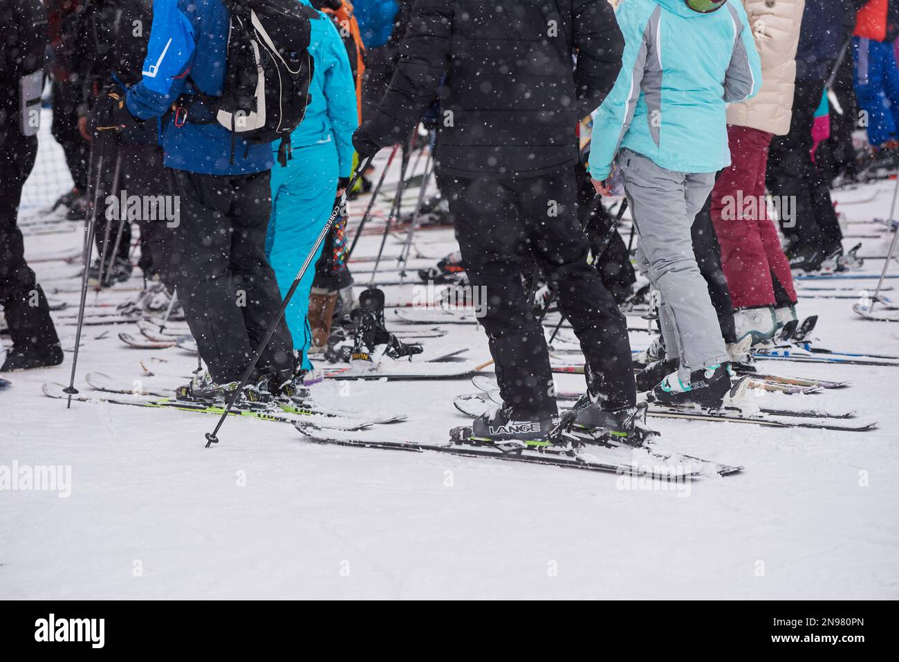 Crowd of people of skiers in line in ski resort Stock Photo - Alamy