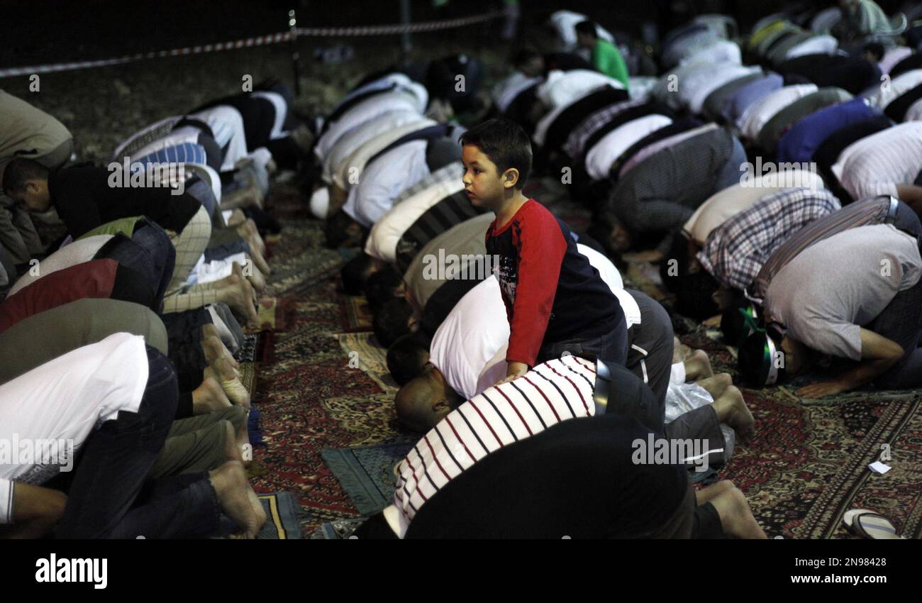 Syrians pray during Laylat Al Qadr, the 27th day of the holy fasting ...