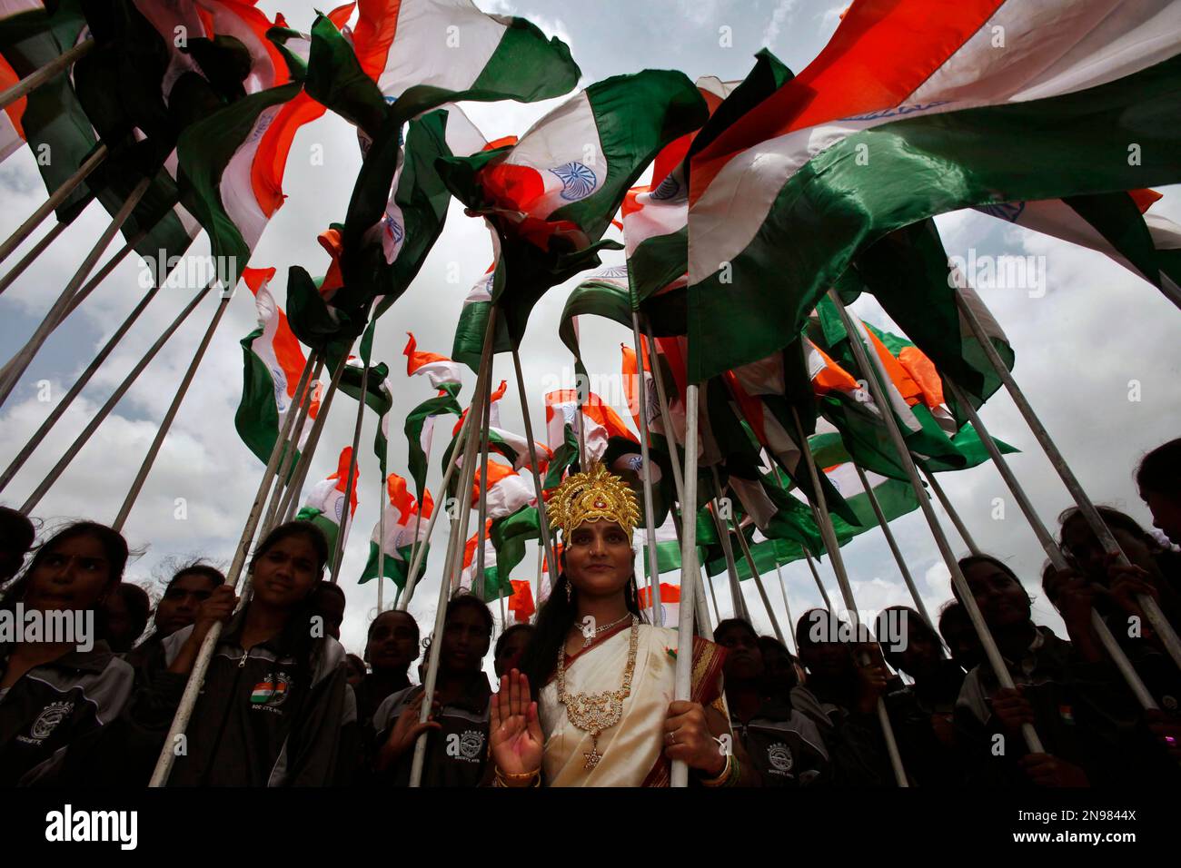 A woman dressed as Bharat Mata, or Mother India, poses with Indian ...