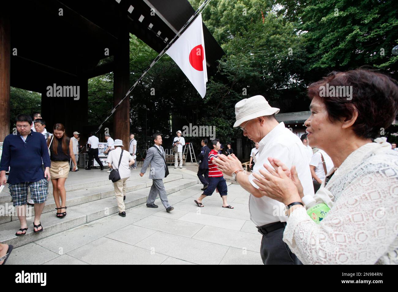 Visitors pray at Yasukuni Shrine, a memorial honoring Wold War II dead ...