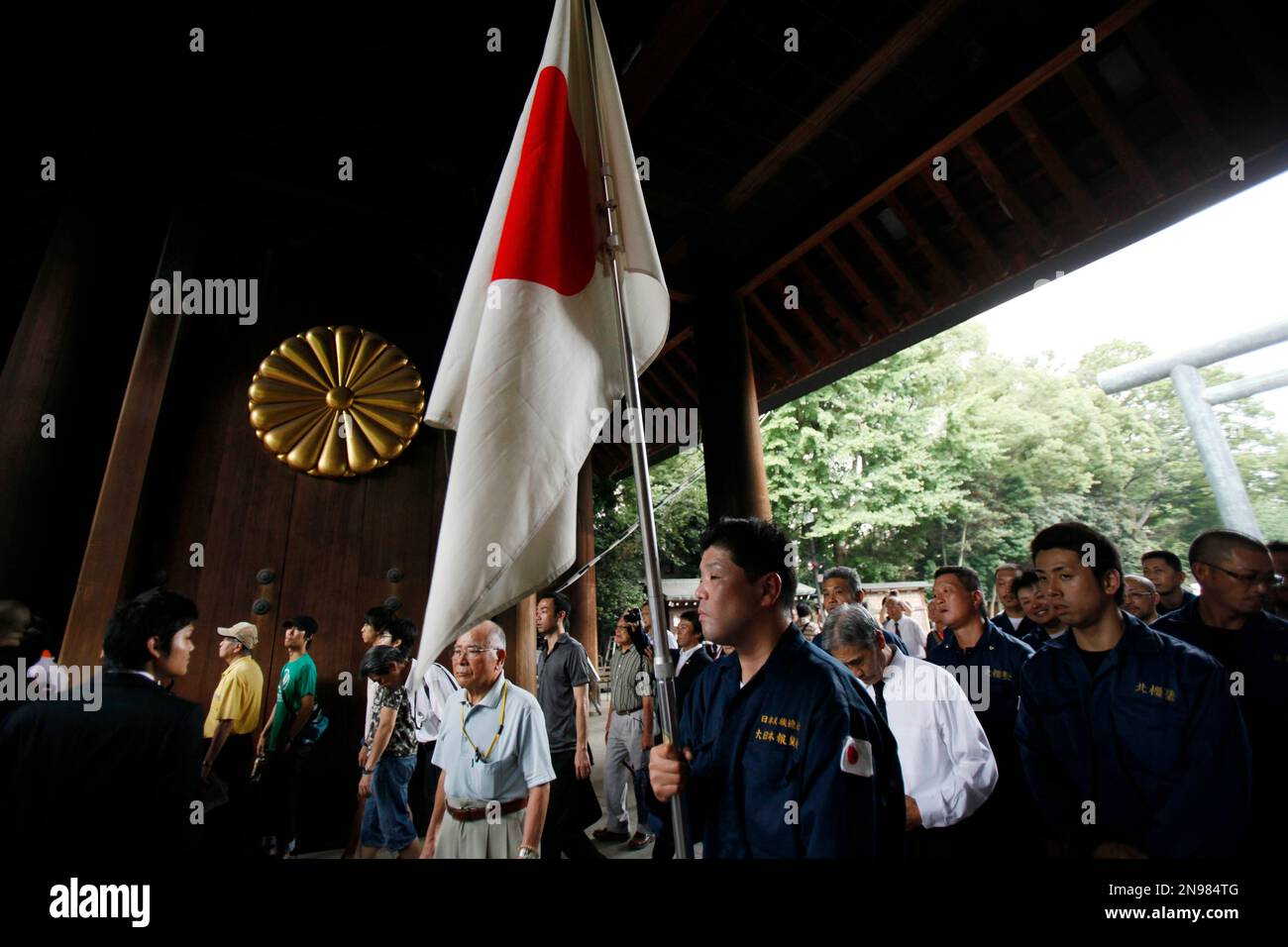 Visitors enter the main gate of Yasukuni Shrine during a ceremony ...