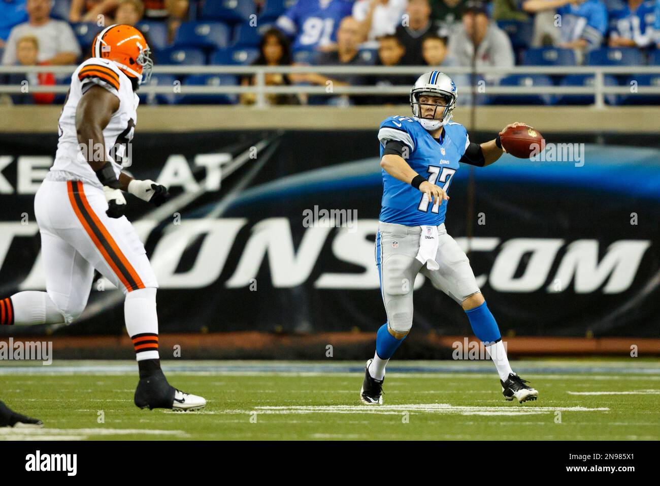 Detroit Lions quarterback Kellen Moore (17) rolls out to pass as ...