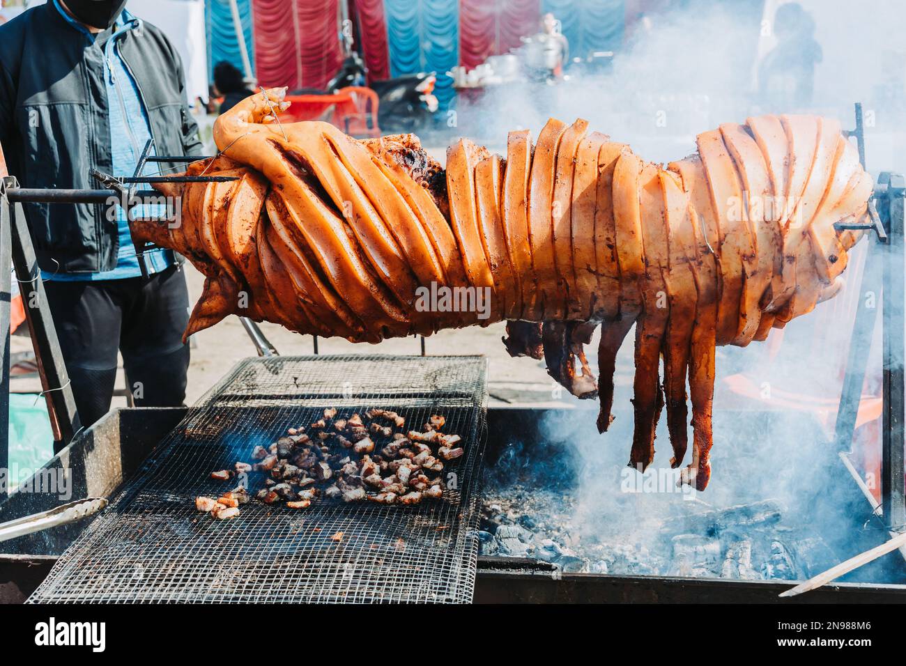 Whole Pork barbeque on a charcoal grill outdoor Stock Photo - Alamy