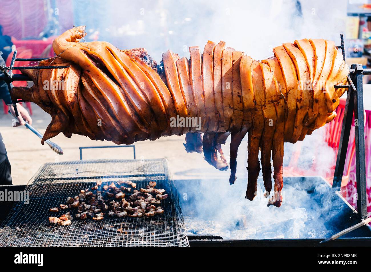 Whole Pork barbeque on a charcoal grill outdoor Stock Photo - Alamy
