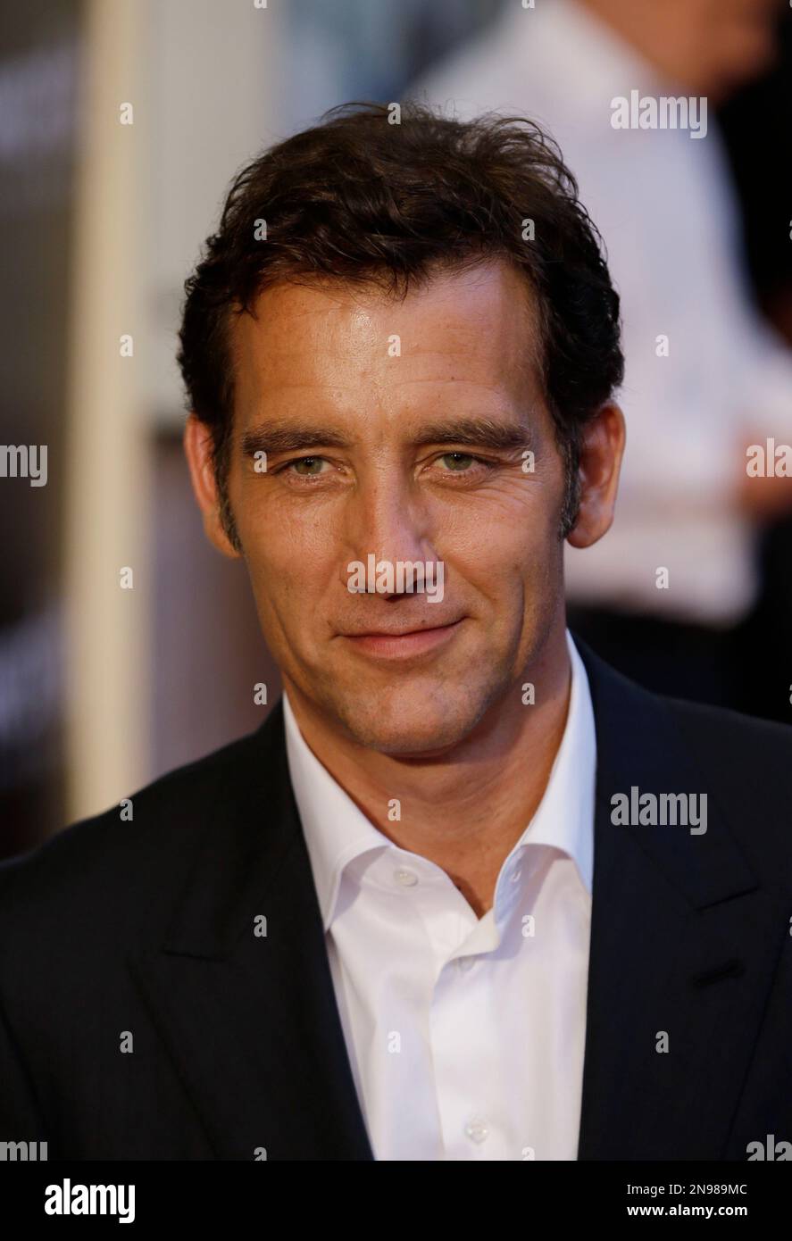 British actor Clive Owen poses for the photographers as he attends the ...