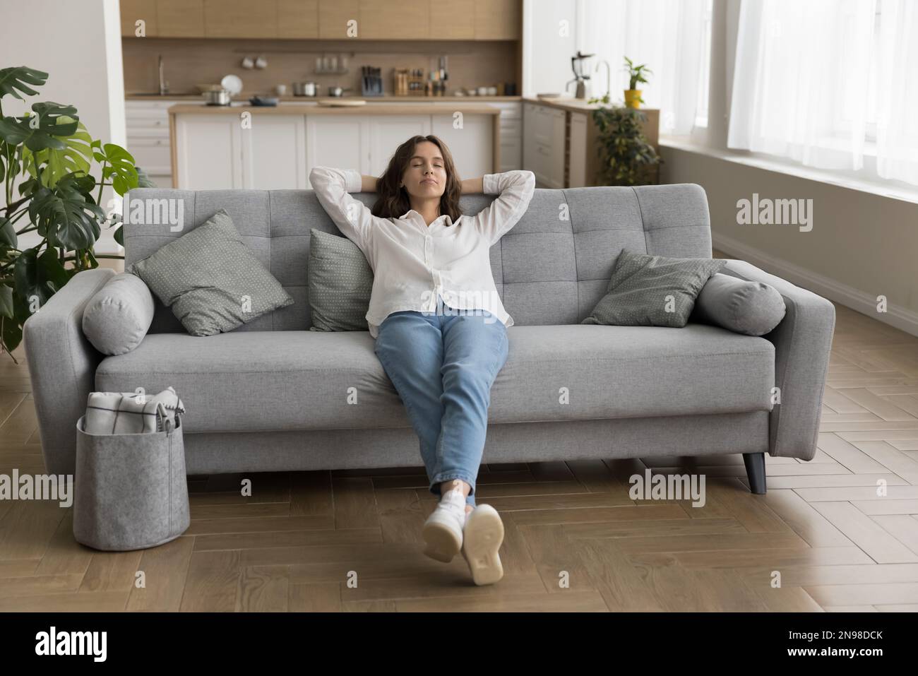 Relaxed person sitting on sofa hi-res stock photography and images - Alamy