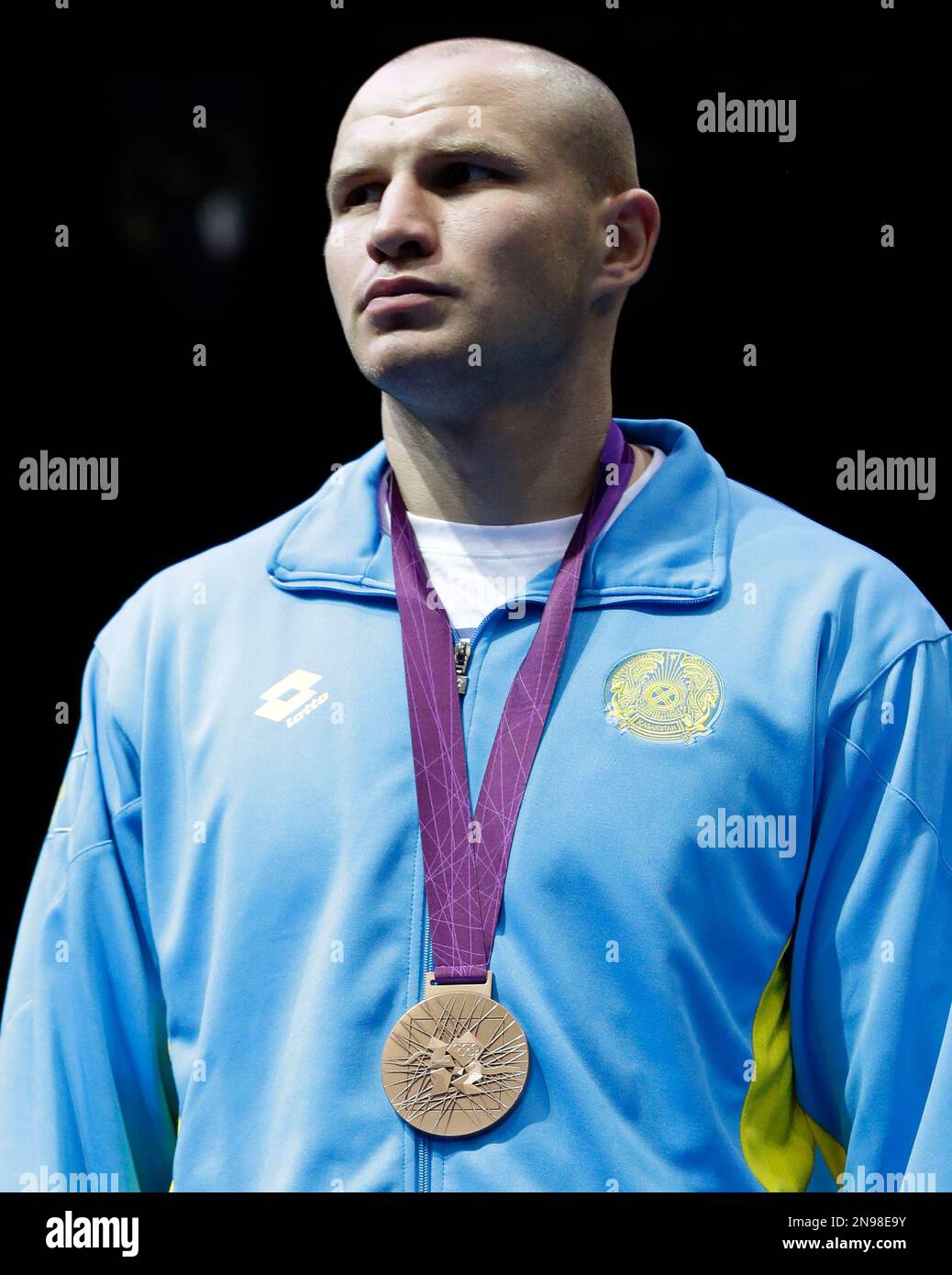 Bronze medalist Ivan Dychko of Kazakhstan poses with his medal after ...