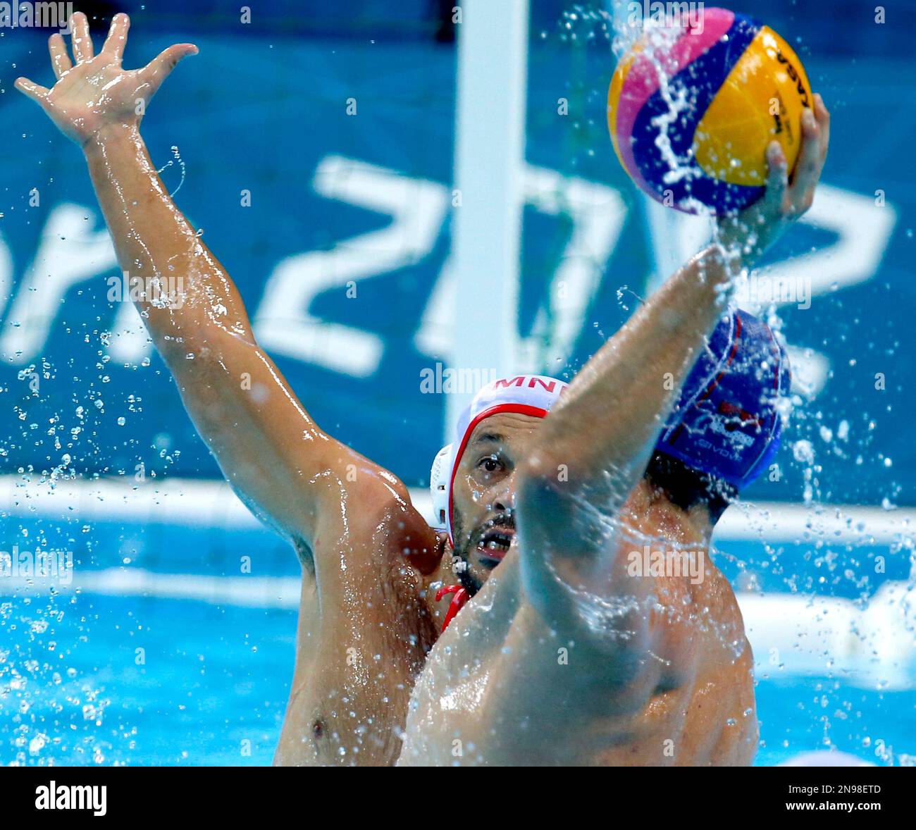 Serbia's Filip Filipovic, right, shoots against Montenegro's Predrag ...