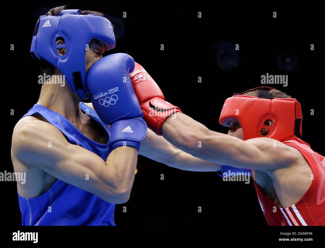 Ukraine's Vasyl Lomachenko, right, fights South Korea's Han Soonchul in ...