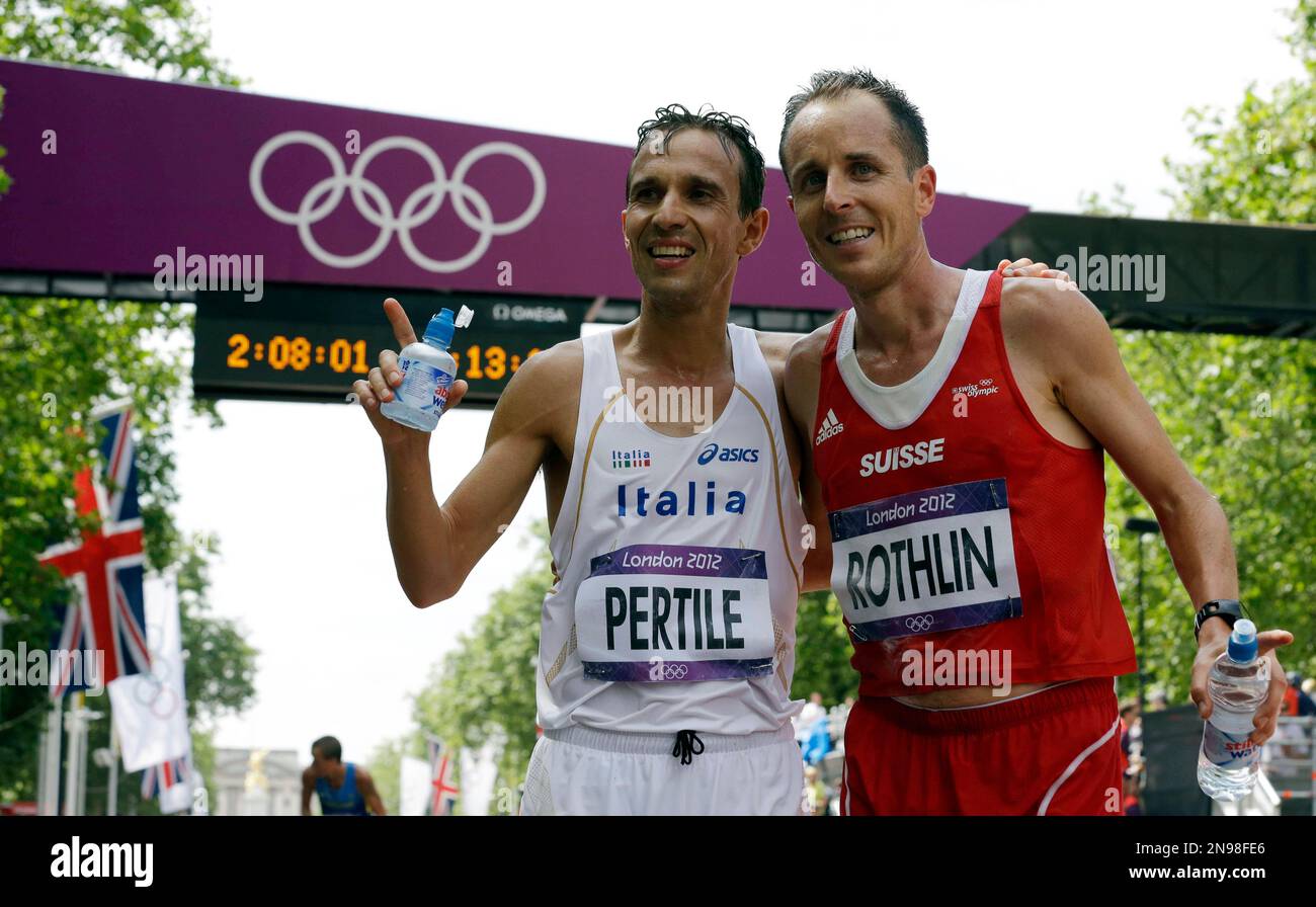 Ruggero Pertile of Italy, left, and Victor Rothlin of Switzerland hug ...
