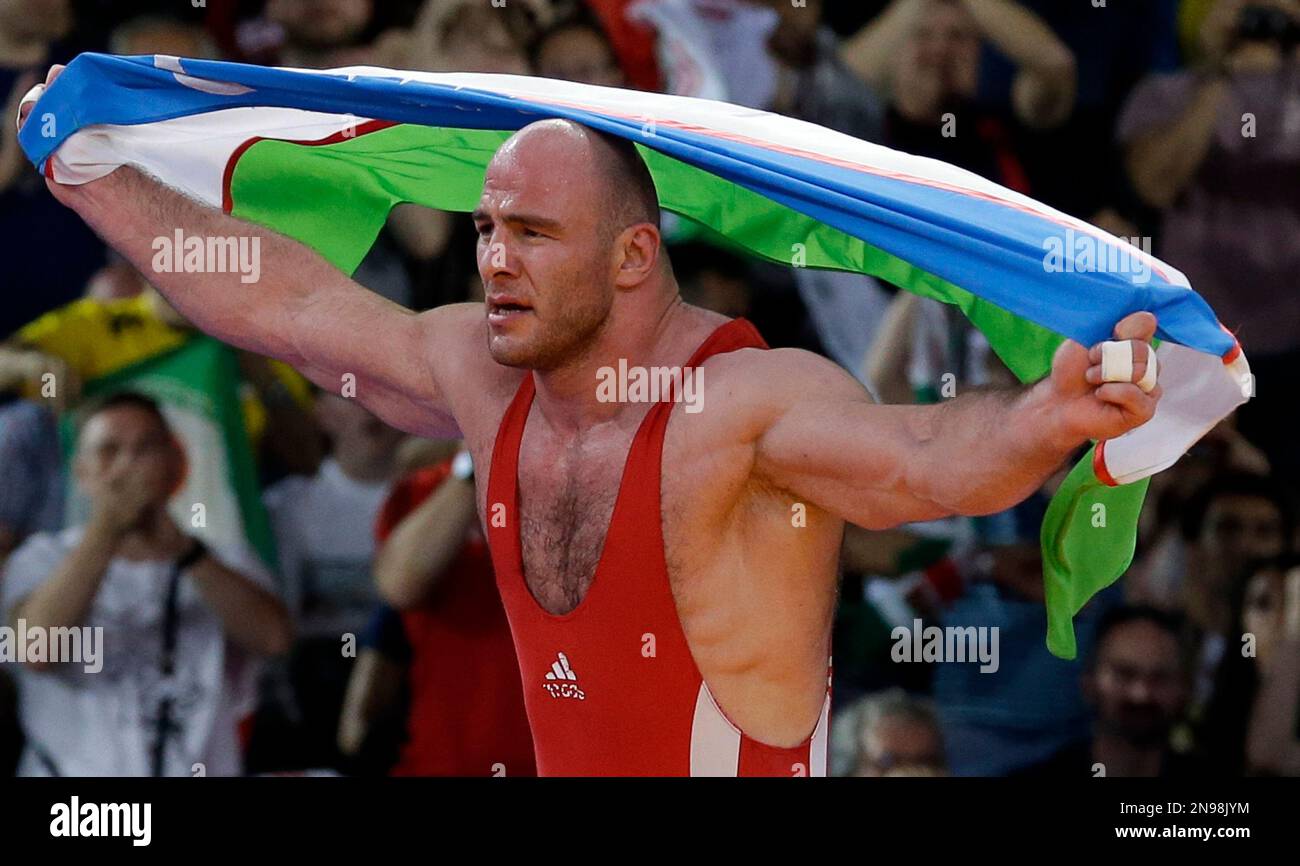 Artur Taymazov of Ukbekistan celebrates after he beat Davit ...