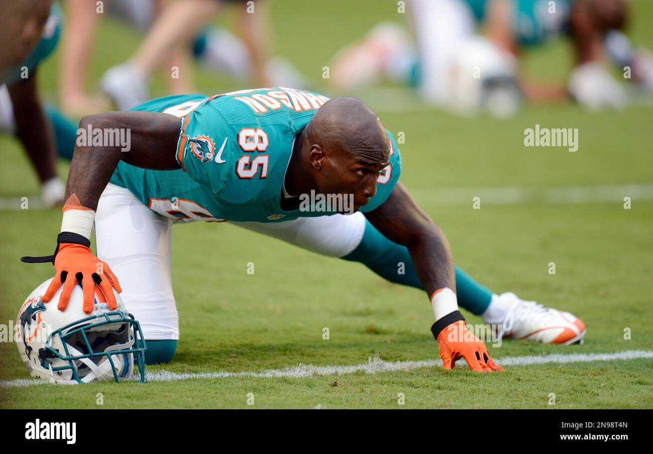 Miami Dolphins wide receiver Chad Johnson (85) stretches during warm ...