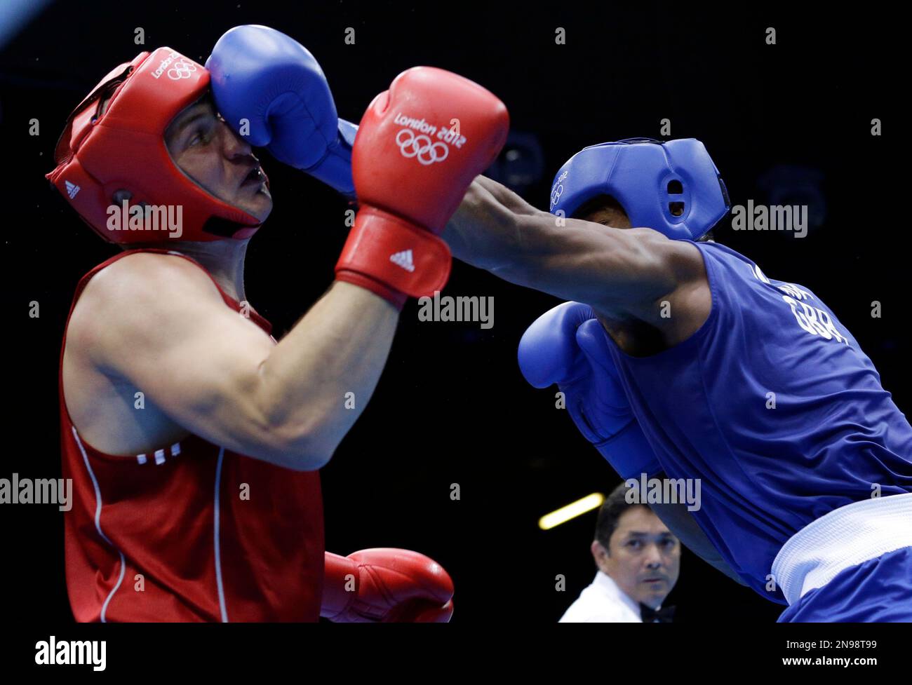 Kazakhstan's Ivan Dychko, left, fights Britain's Anthony Joshua in a super heavyweight over 91 ...