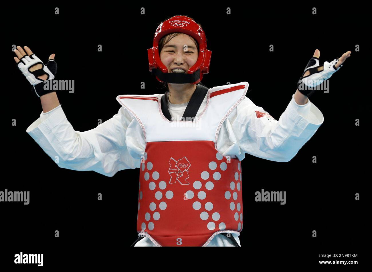 South Korea's Hwang Kyung-seon celebrates after defeating Turkey's Nur ...