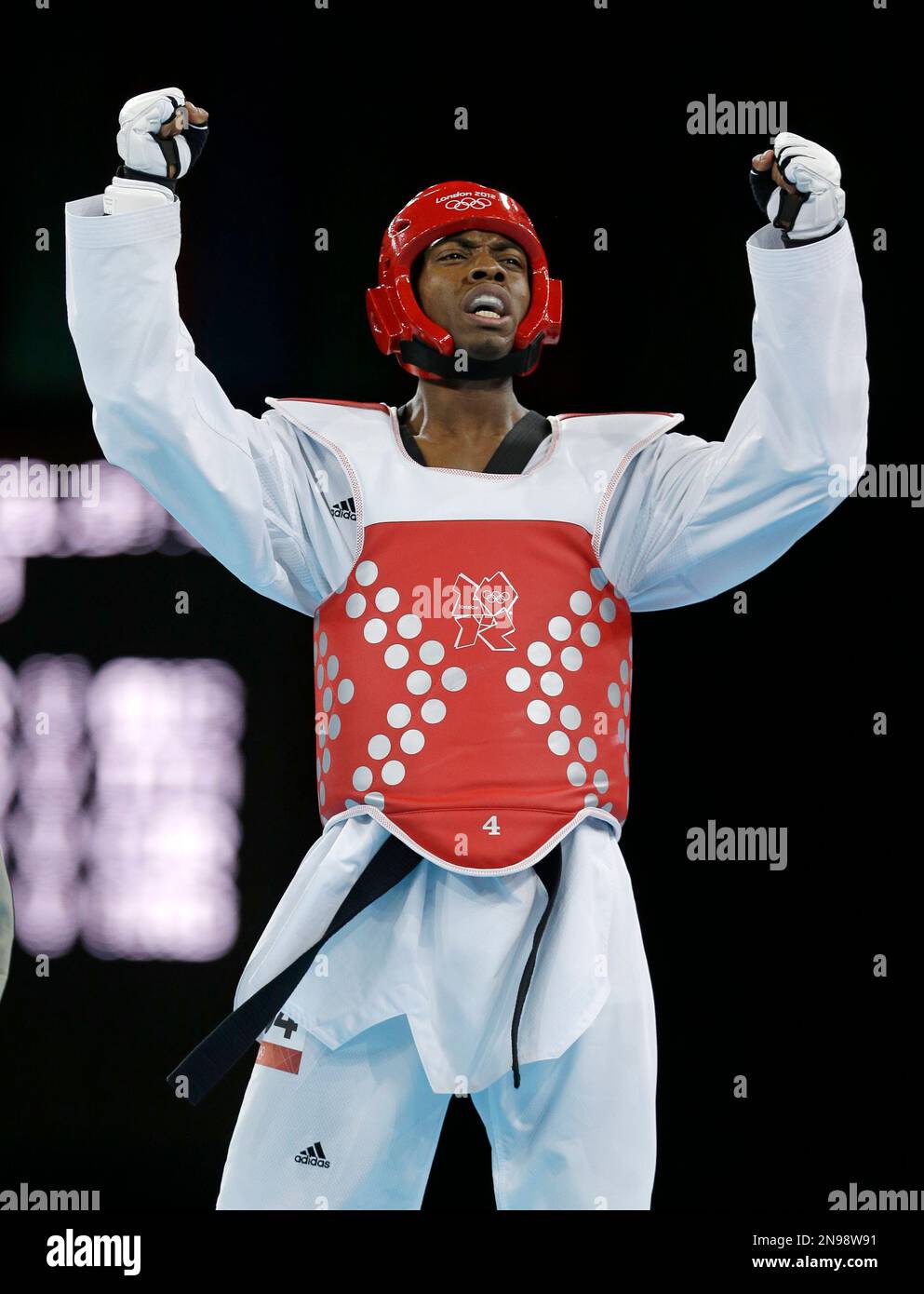 Britain's Lutalo Muhammad celebrates after defeating Armenia's Arman ...