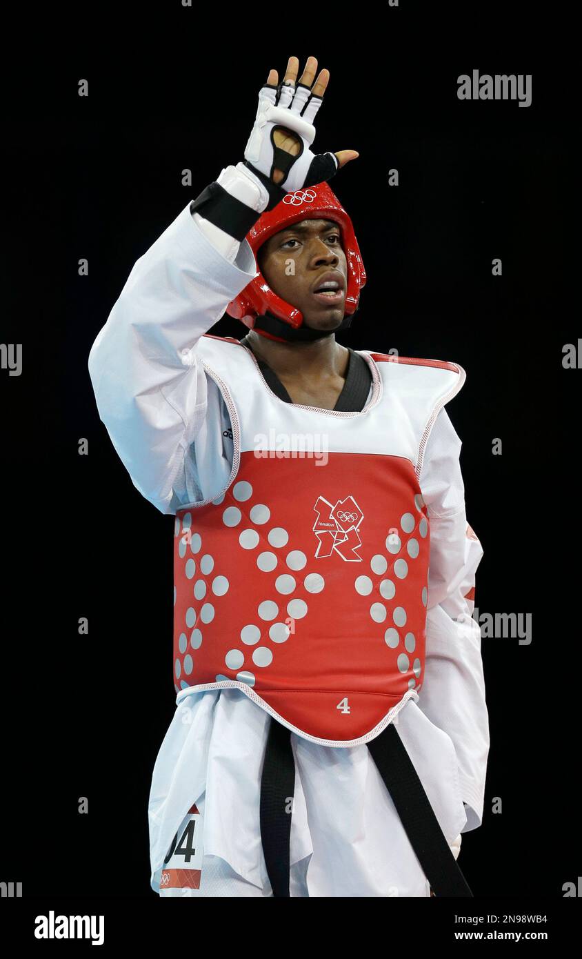 Britain's Lutalo Muhammad celebrates after defeating Armenia's Arman ...