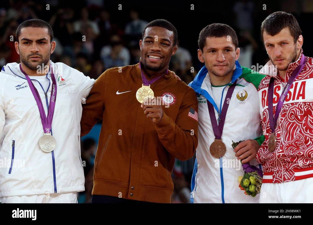 From left, silver medalist Iran's Sadegh Saeed Goudarzi, gold medalist ...
