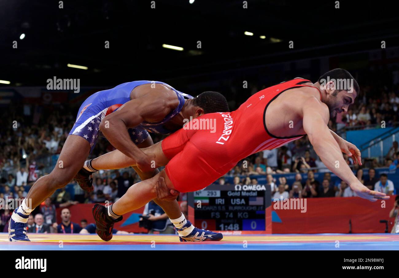 United States' Jordan Ernest Burroughs, in blue, competes against Iran ...