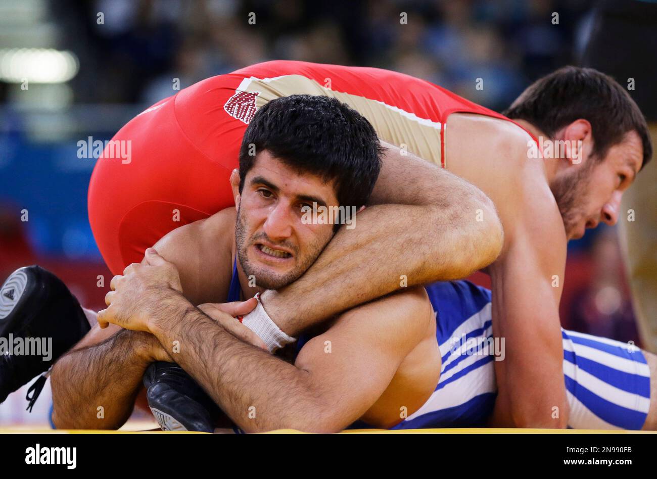 Russia's Denis Tsargush, in red, and Azerbijian's Ashraf Aliyev in blue ...
