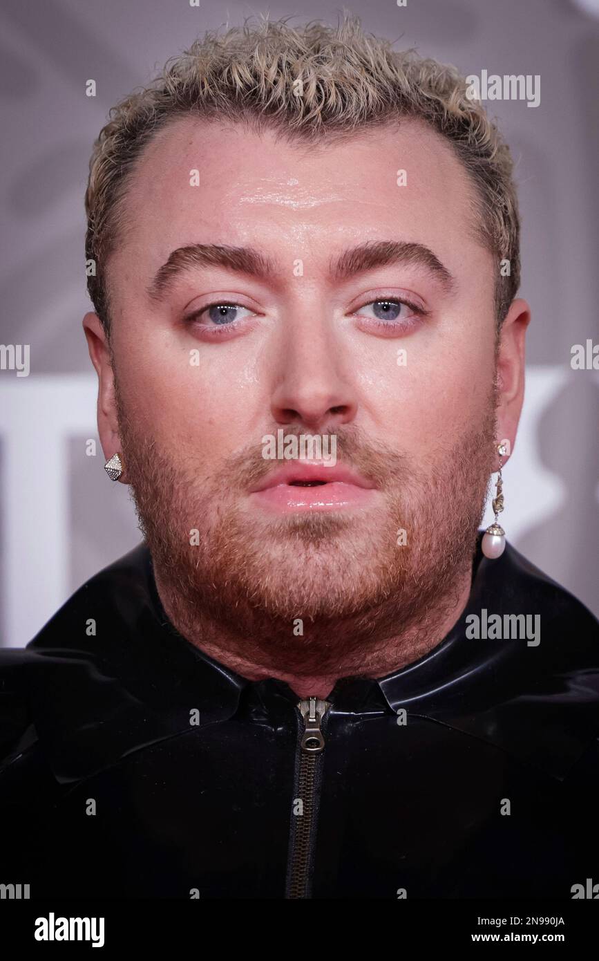 Sam Smith poses for photographers upon arrival at the Brit Awards 2023 ...