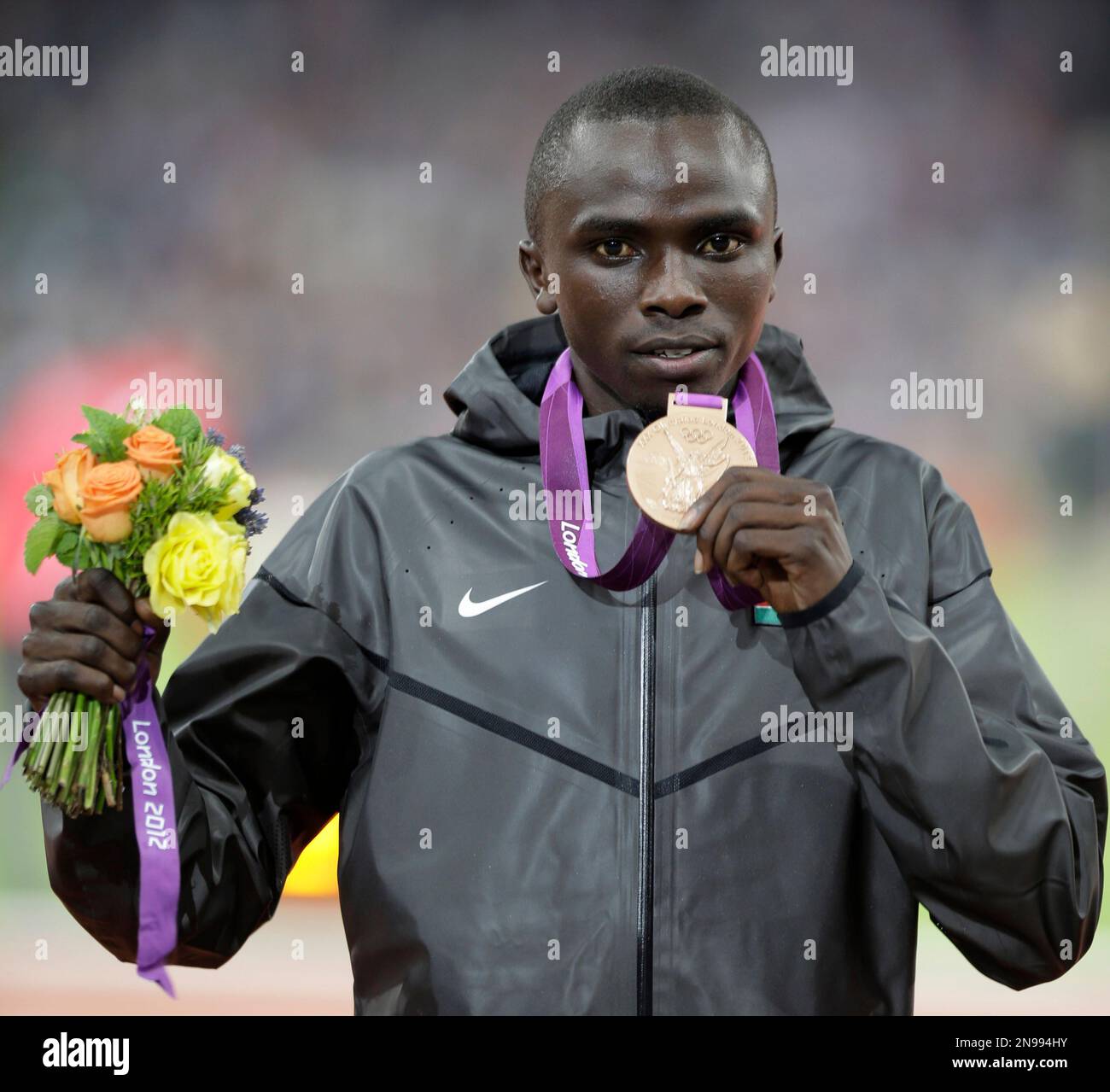 Kenya's Timothy Kitum displays the bronze medal during the ceremony for ...