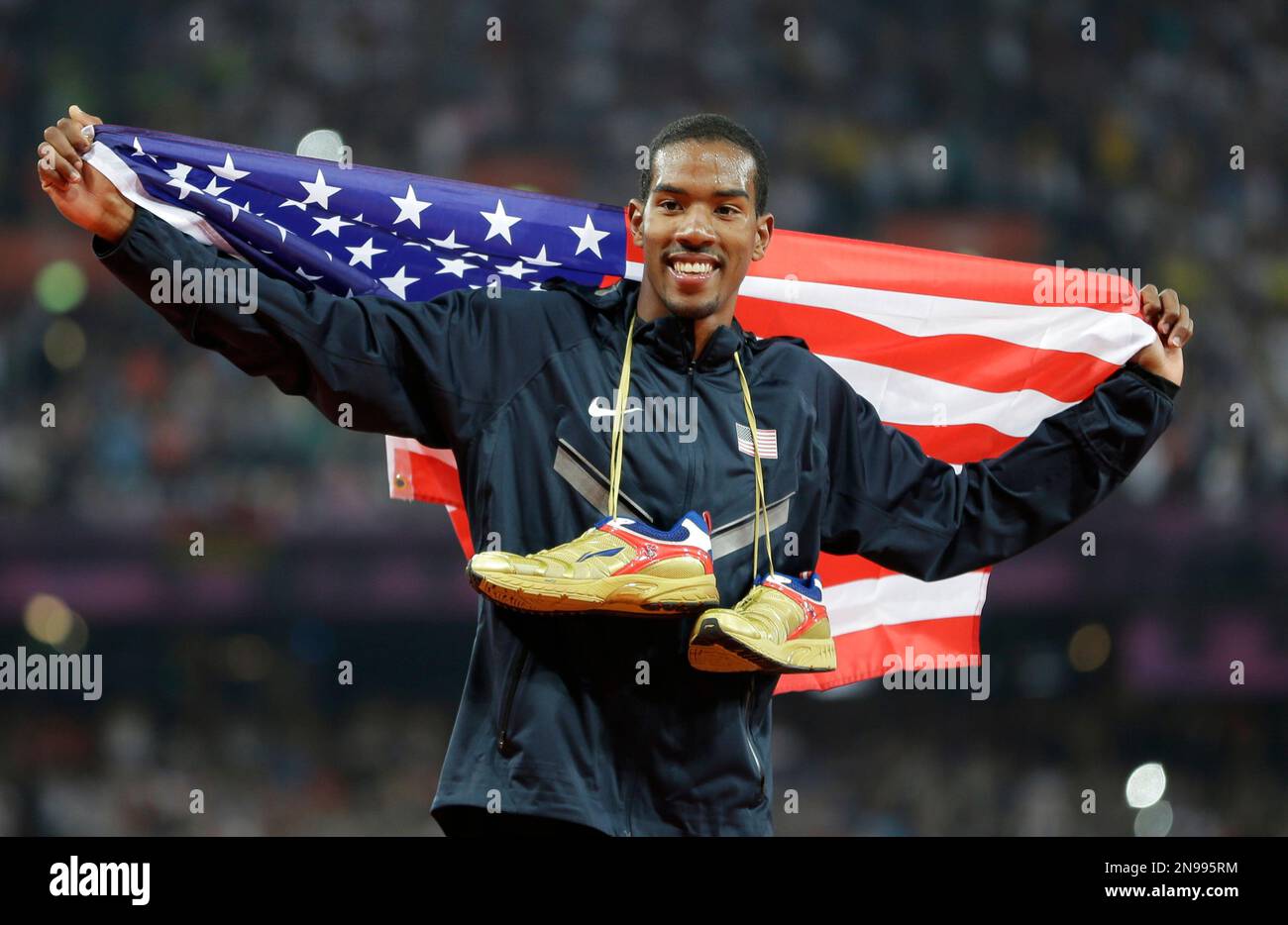 United States' Christian Taylor celebrates winning the gold medal in ...