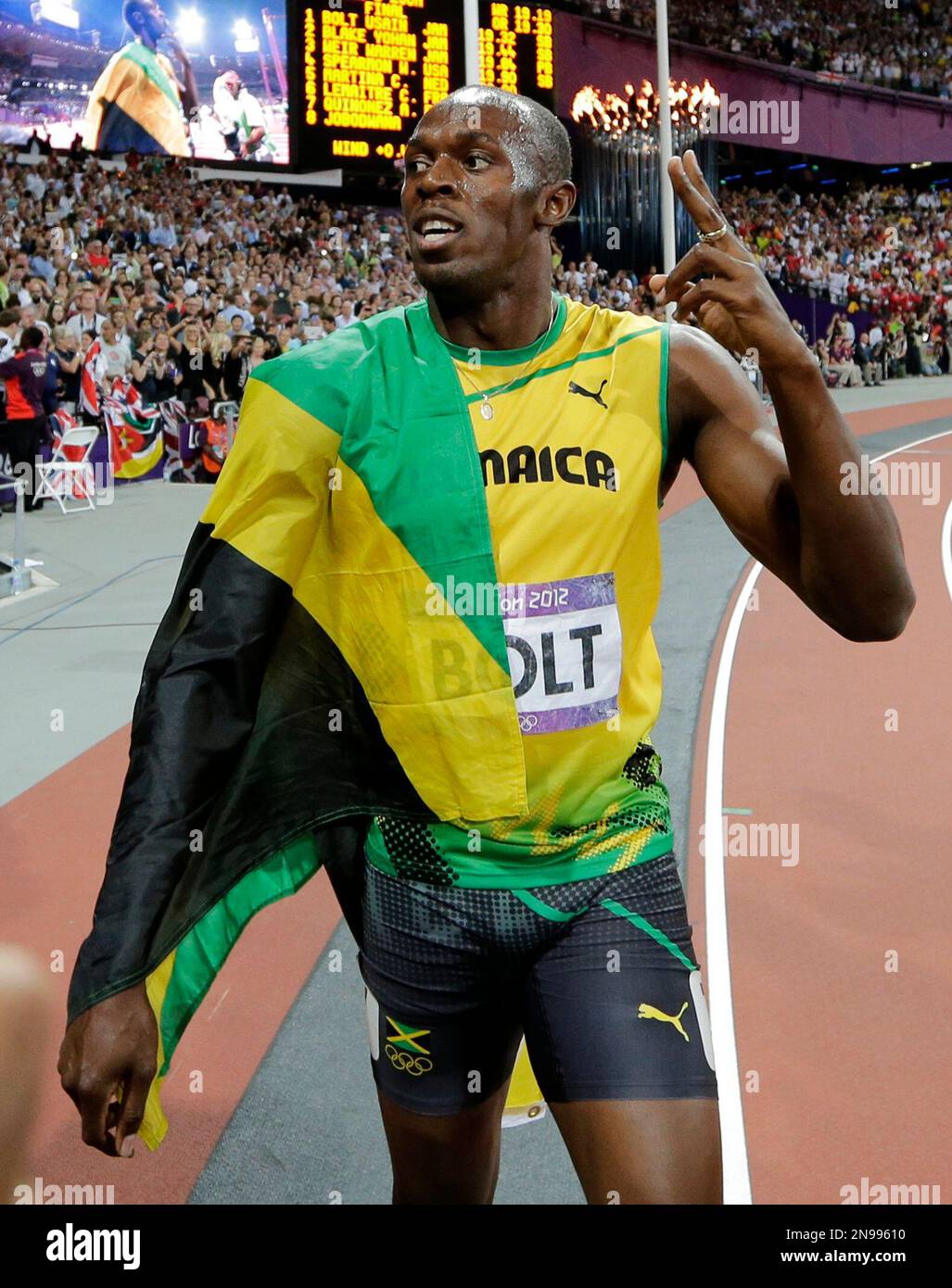 Jamaica's Usain Bolt celebrates winning gold in the men's 200-meter ...