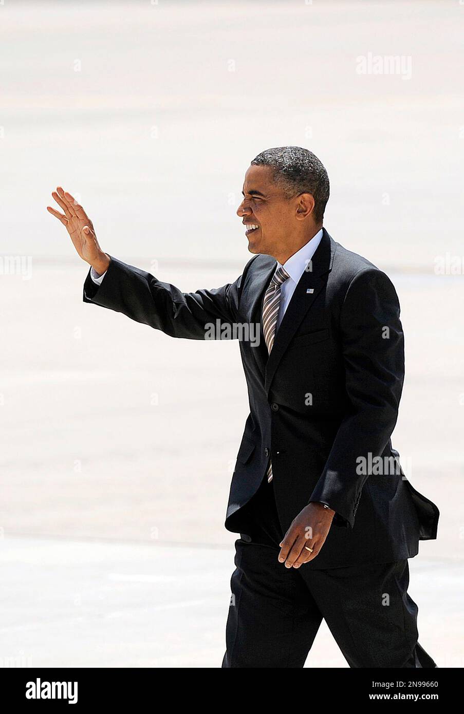 President Barack Obama waves to supporters as he arrives at Peterson ...