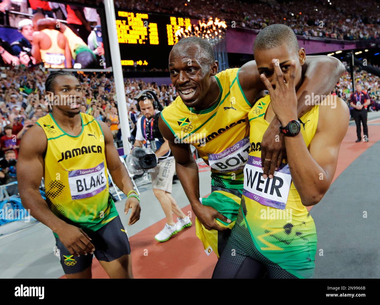Jamaica's Usain Bolt, center, Jamaica's Yohan Blake, left, and Jamaica ...