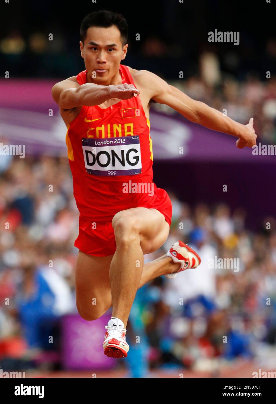 China's Dong Bin competes in the men's triple jump final during the ...